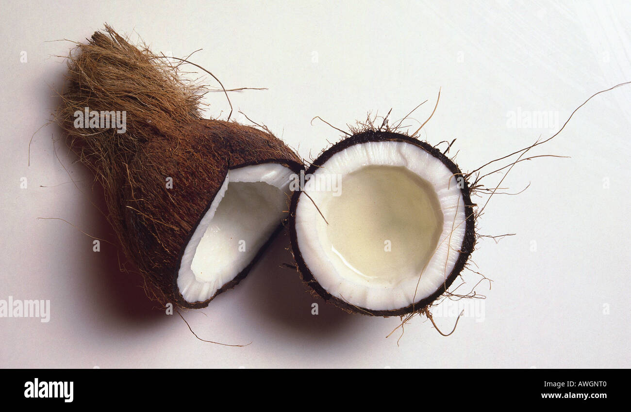 Coconut split in half Stock Photo - Alamy