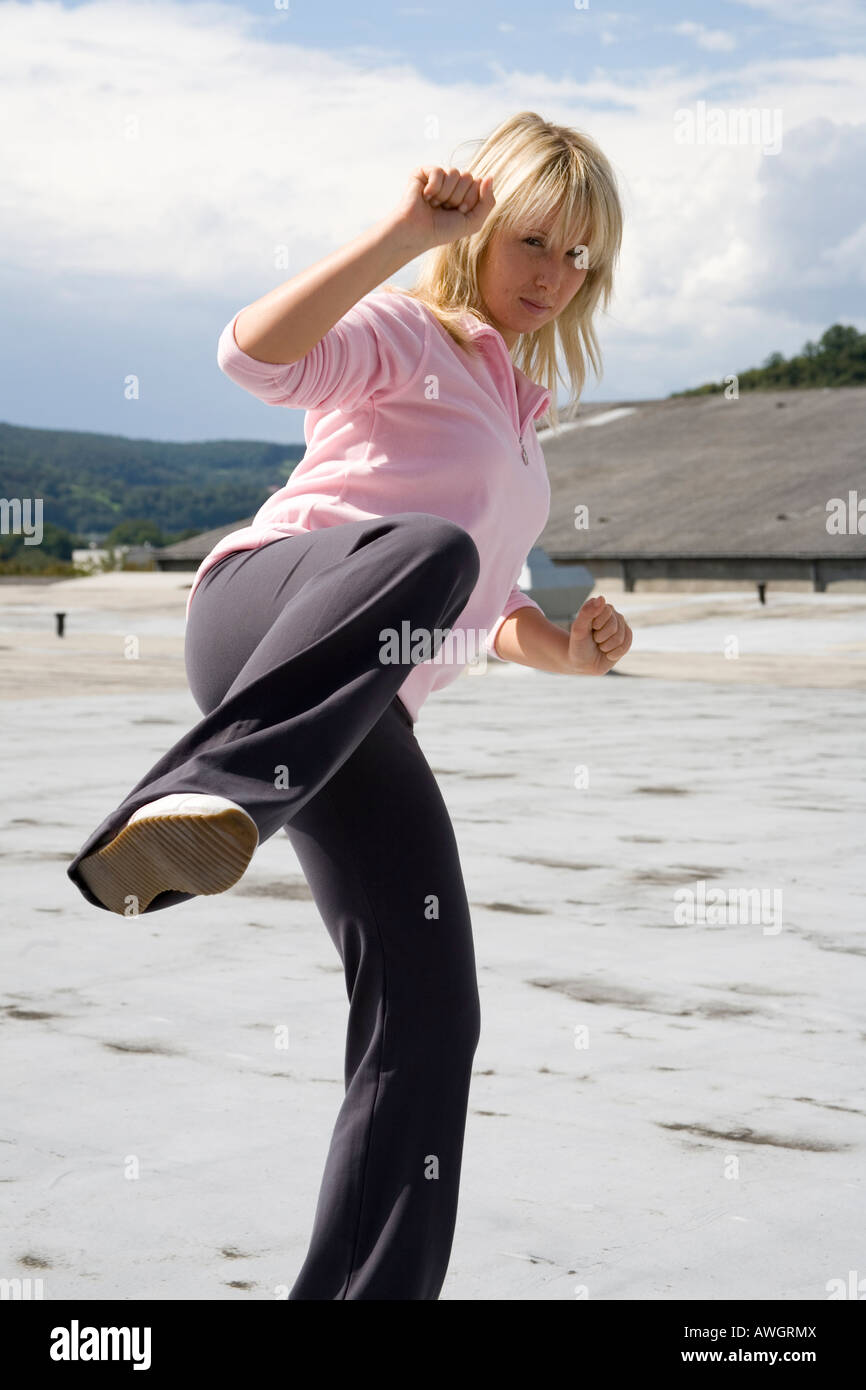 blonde woman trains taebo Stock Photo - Alamy