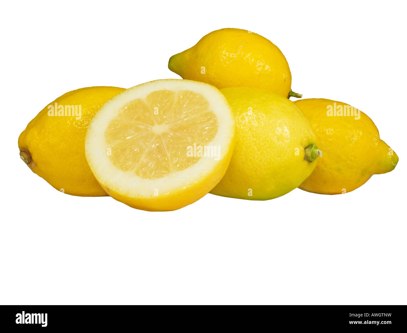 ripe lemons pile with a lemon sliced Stock Photo - Alamy