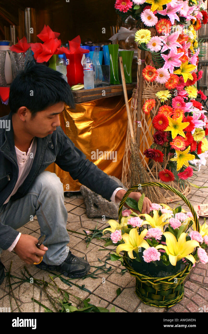 Chinese Florist at Womens Street Flower Market Stock Photo - Alamy
