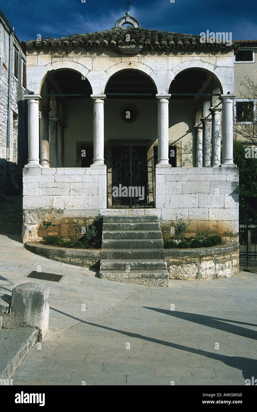 Open portico and entrance gate of small 15th century church hi-res ...