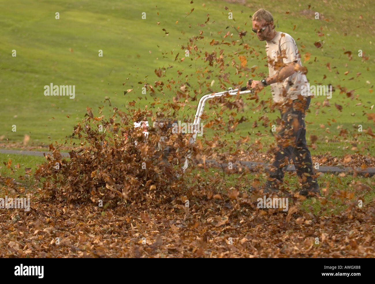 Man blowing leaves hi-res stock photography and images - Alamy