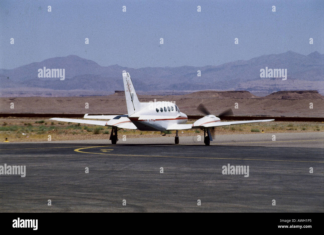 Light aircraft on domestic flight landing on airport runway hi-res ...