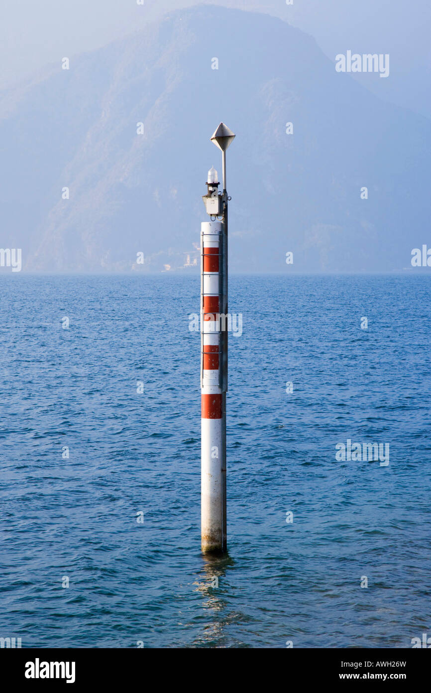 Red and white navigation post Lake Como Italy Stock Photo - Alamy