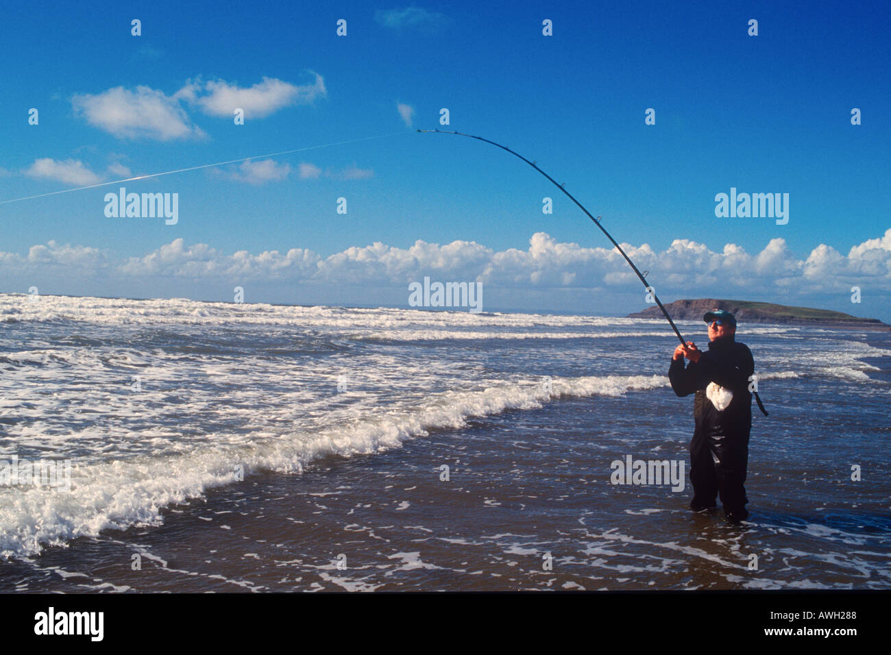 Angler Bass Fishing at Llangennith Beach Gower Peninsula South Wales ...