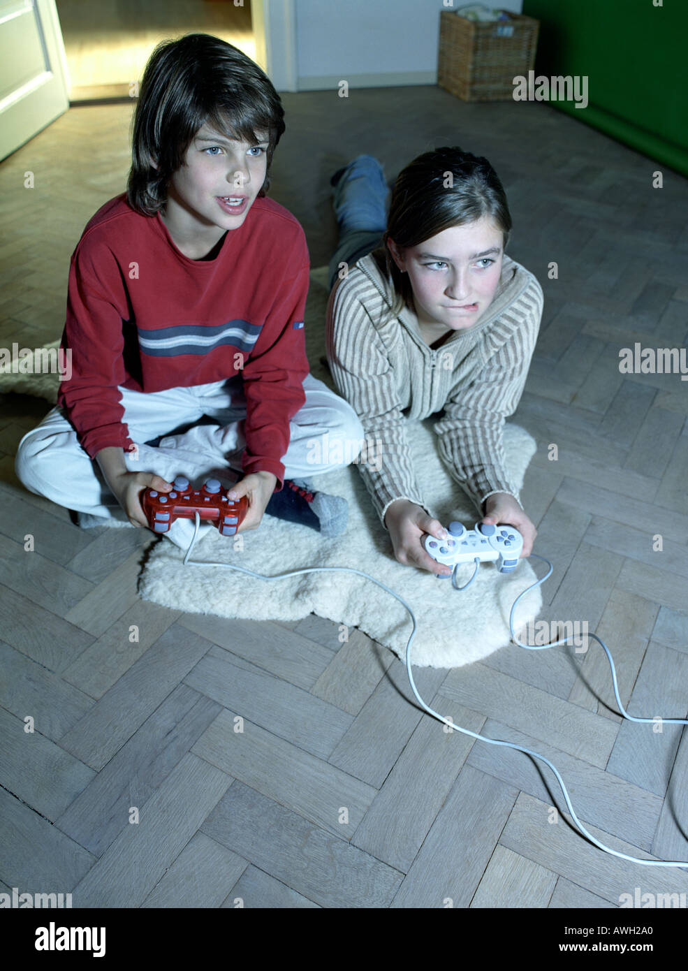 boy and girl playing computer game with controllers Stock Photo - Alamy