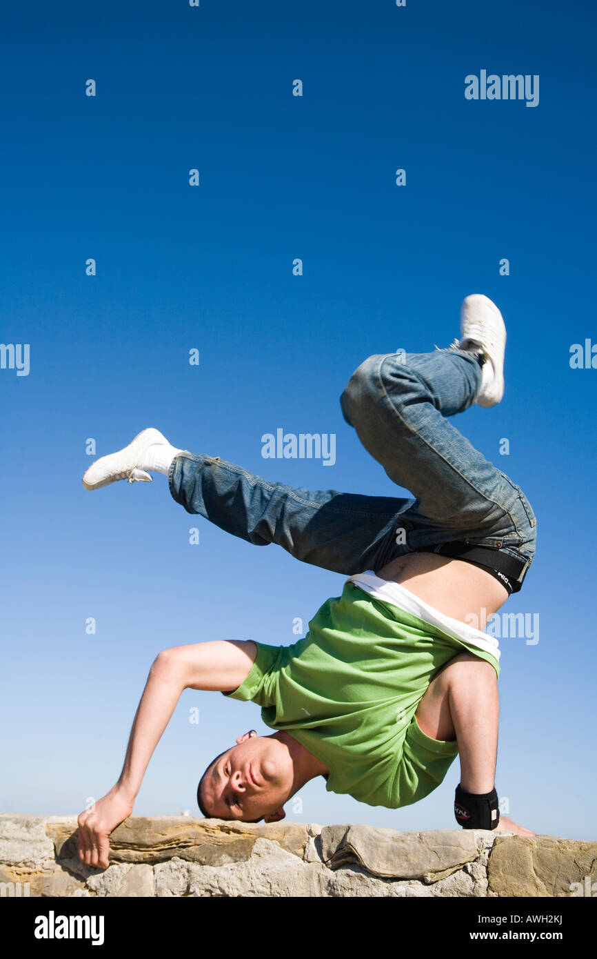 Young man in a breakdance pose Stock Photo - Alamy
