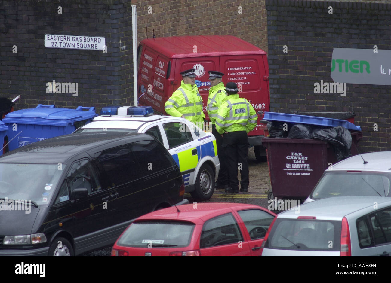 Police officer organise vehicles so a funeral directors van can pick up ...