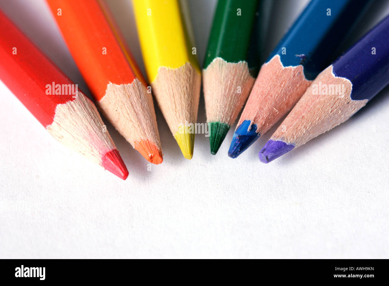 Six pencil crayons arranged in a semi-circle Stock Photo - Alamy