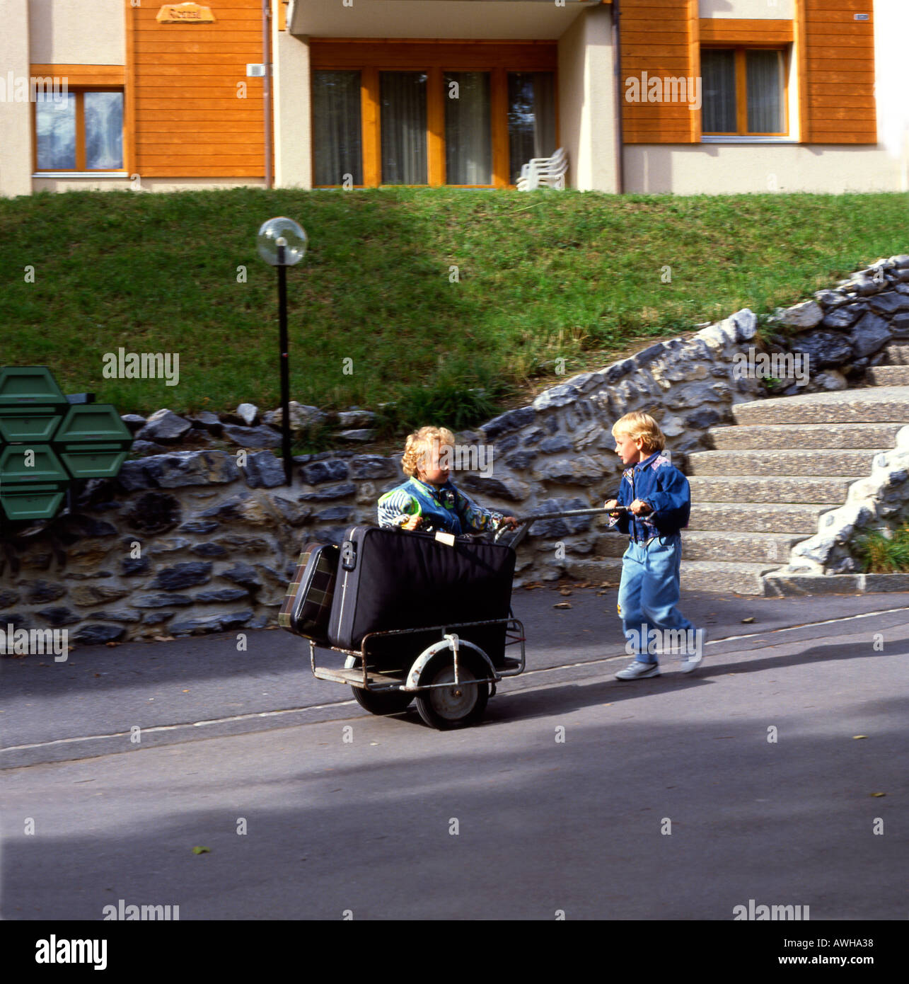 Children with Baggage Trolley at Murren Switzerland Stock Photo - Alamy