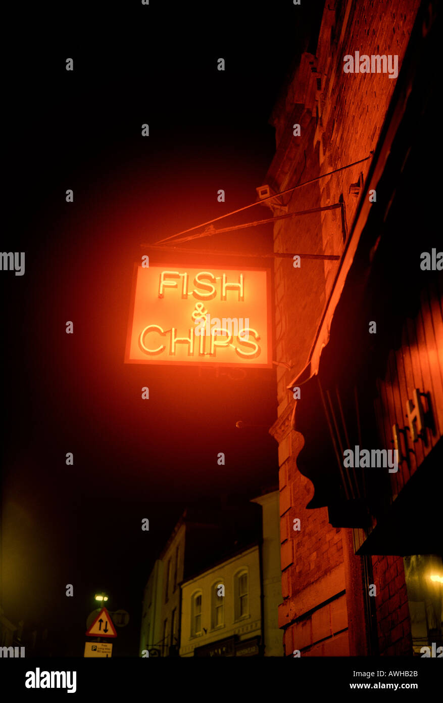 neon fish and chip sign in a small town at night Stock Photo - Alamy