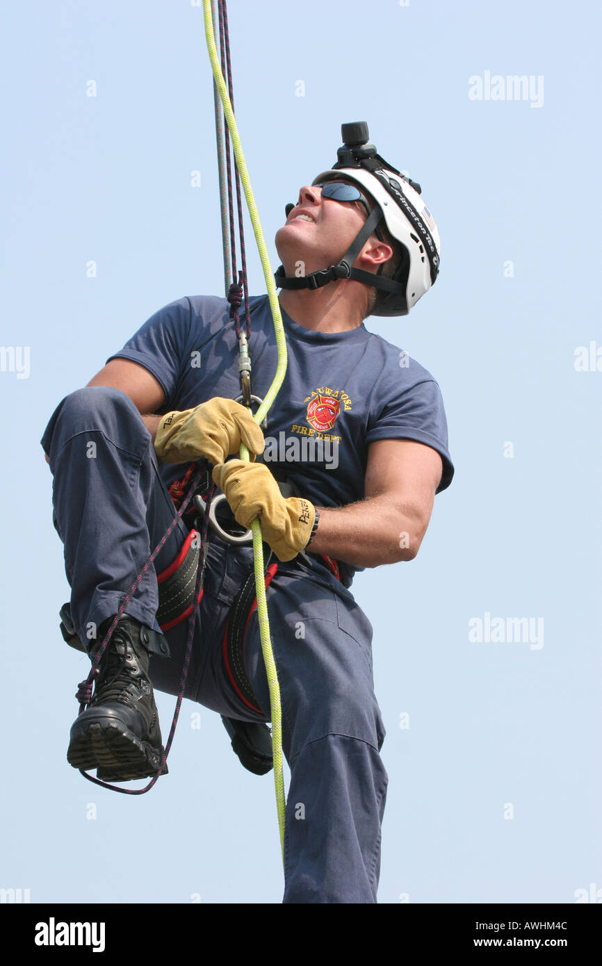 Wauwatosa Fire Department fire fighter climbing arial ropes Stock Photo ...