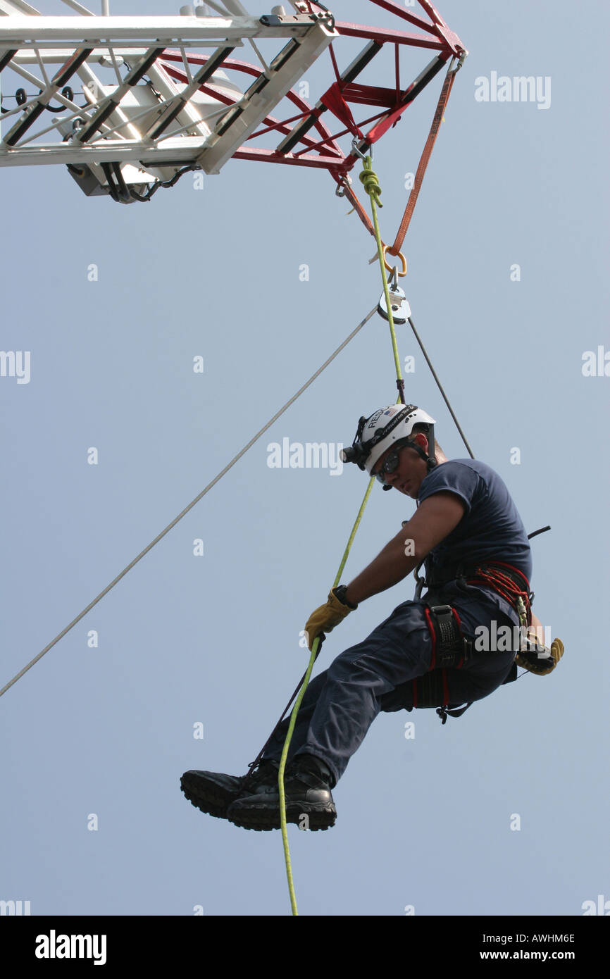 Wauwatosa Fire Department fire fighter climbing arial ropes Stock Photo ...