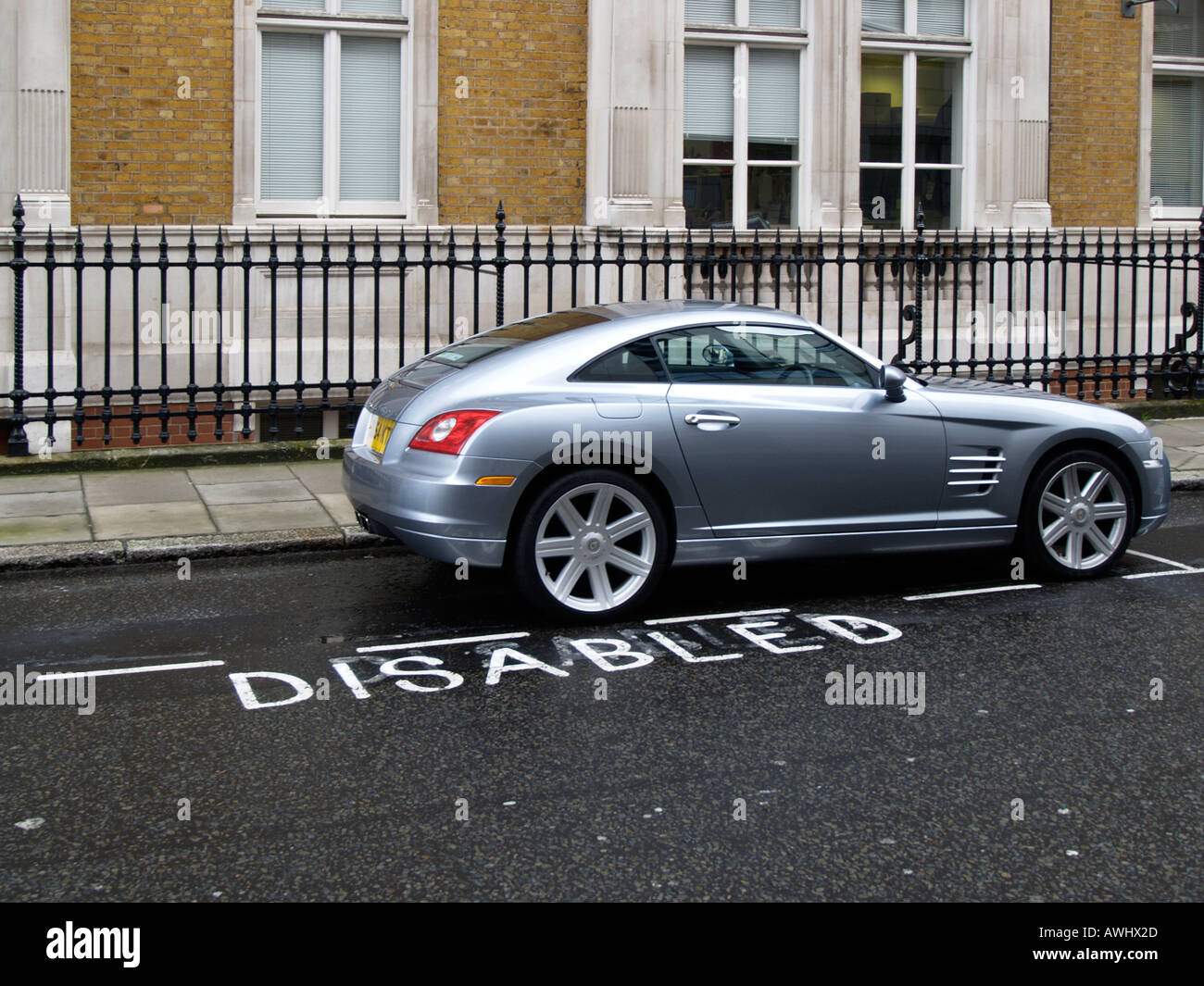 Chrysler Crossfire sportscar parked in disabled handicapped space zone ...
