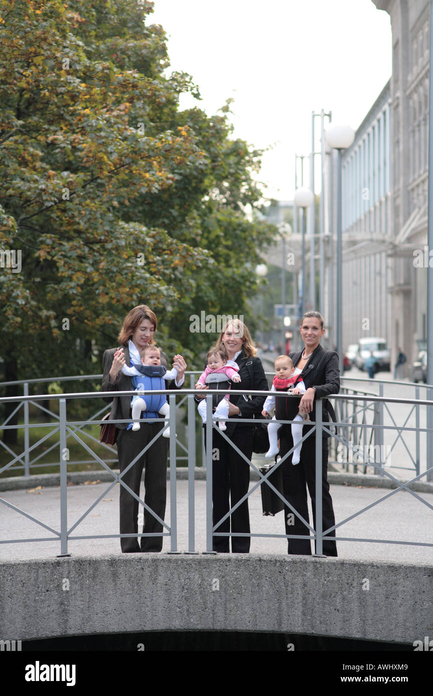 Three business women with their babies going to work manager executive ...