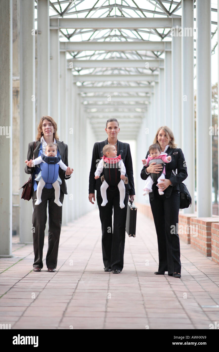 Three business women with their babies going to work manager executive ...