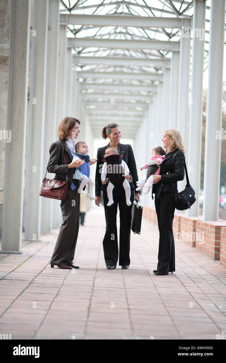 Three business women with their babies going to work manager executive ...