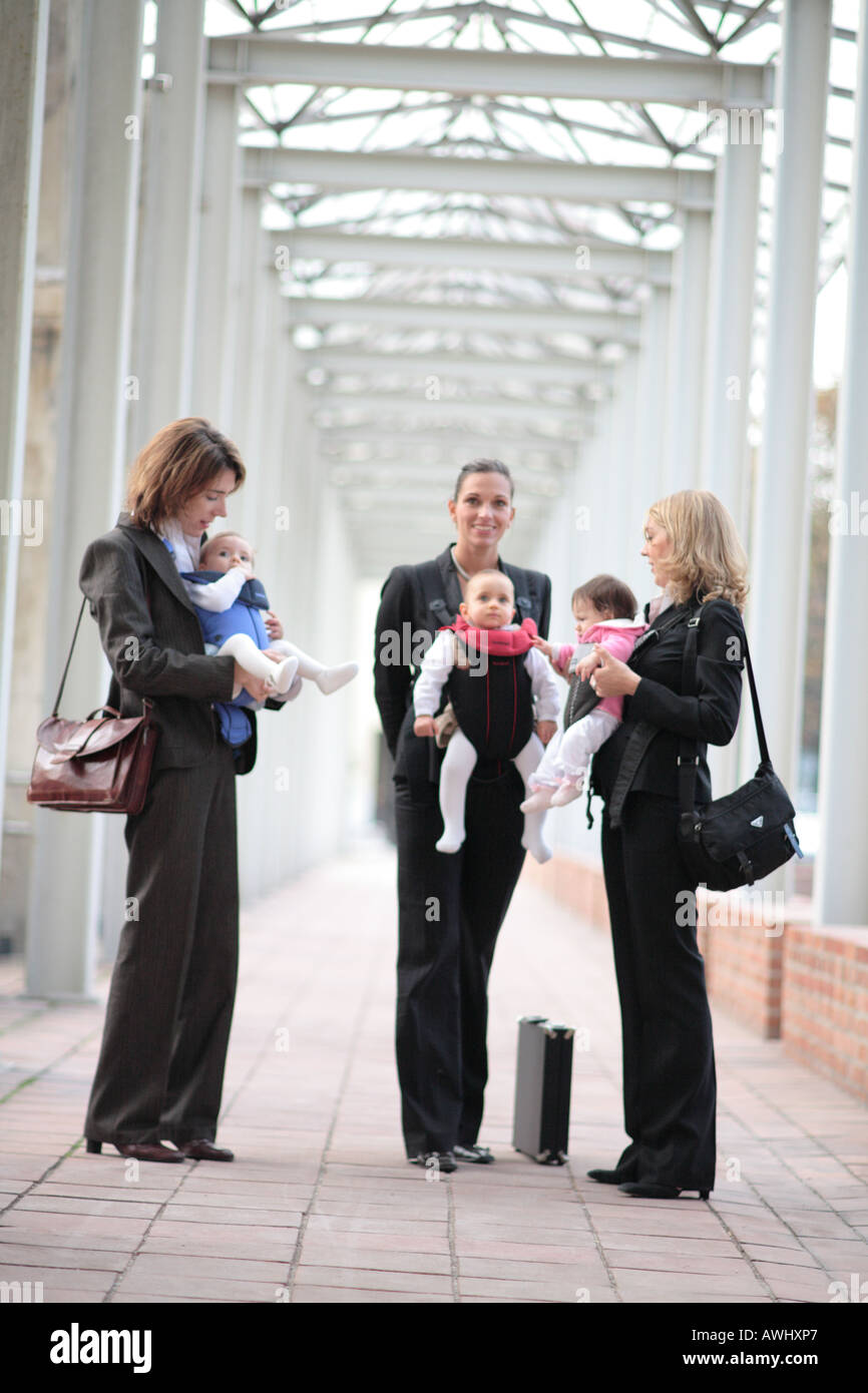 Three business women with their babies going to work manager executive ...