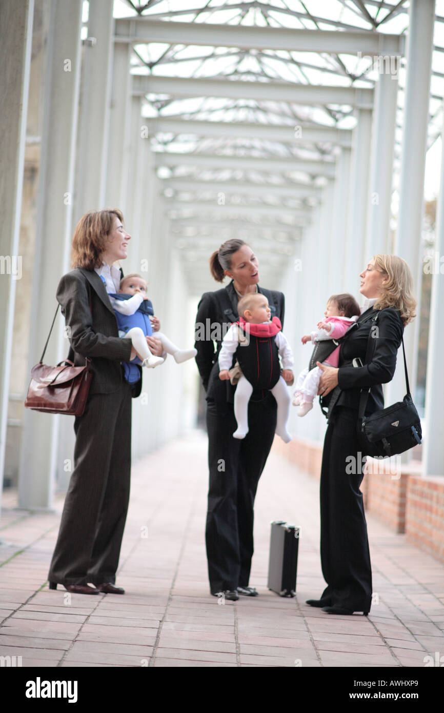 Three business women with their babies going to work manager executive ...