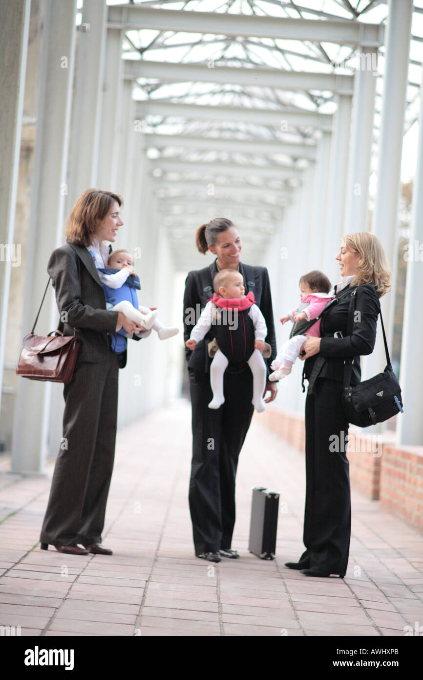 Three business women with their babies going to work manager executive ...
