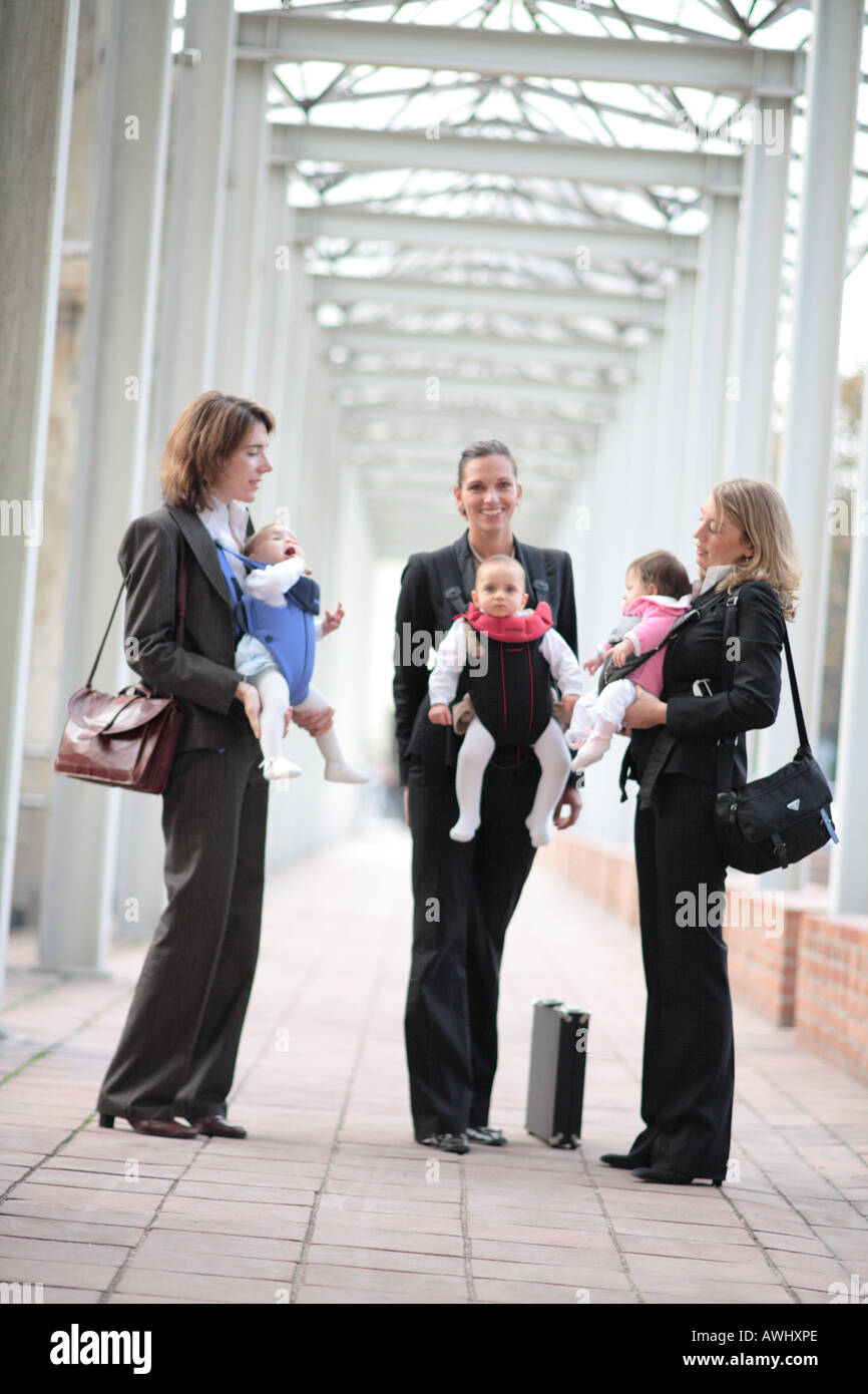 Three business women with their babies going to work manager executive ...