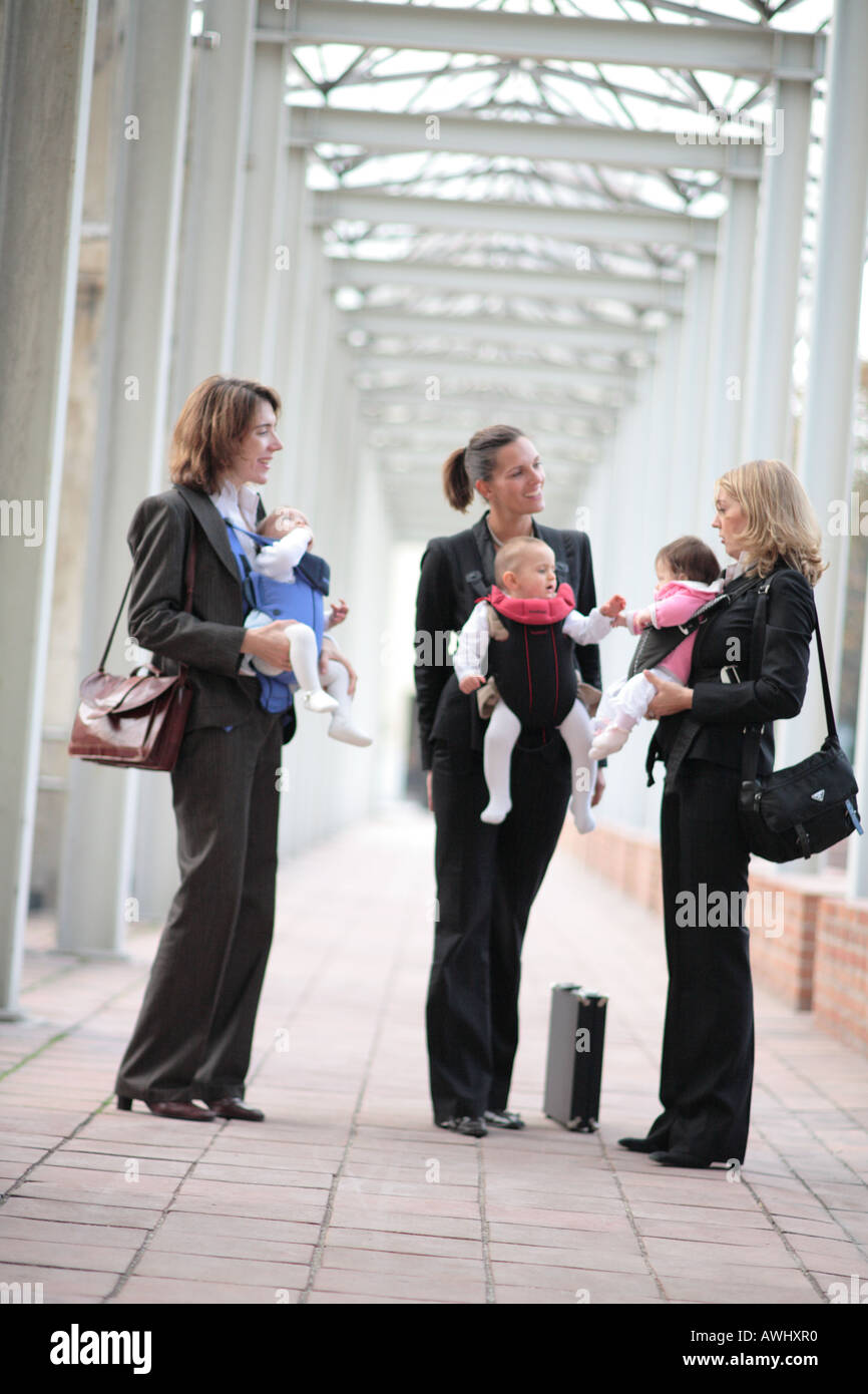 Three business women with their babies going to work manager executive ...