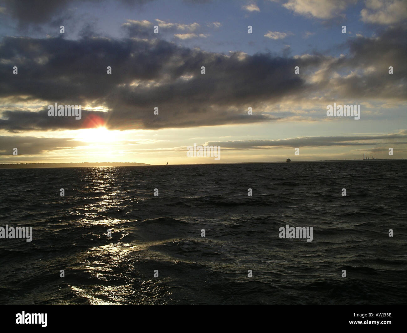 Beam of light on water at dusk Stock Photo - Alamy
