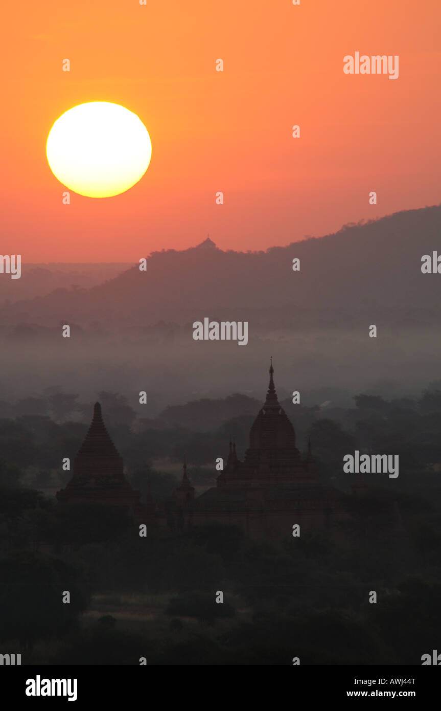 Sun rise above the temples and pagodas of the old ruined city Bagan ...