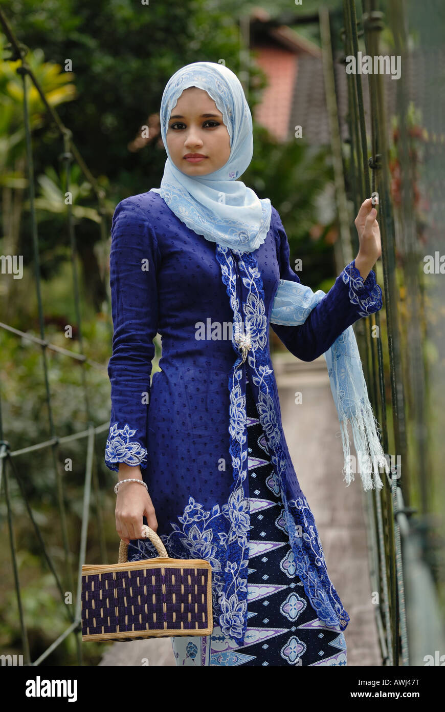 Cute Malaysian Girl with scarf in village Stock Photo - Alamy