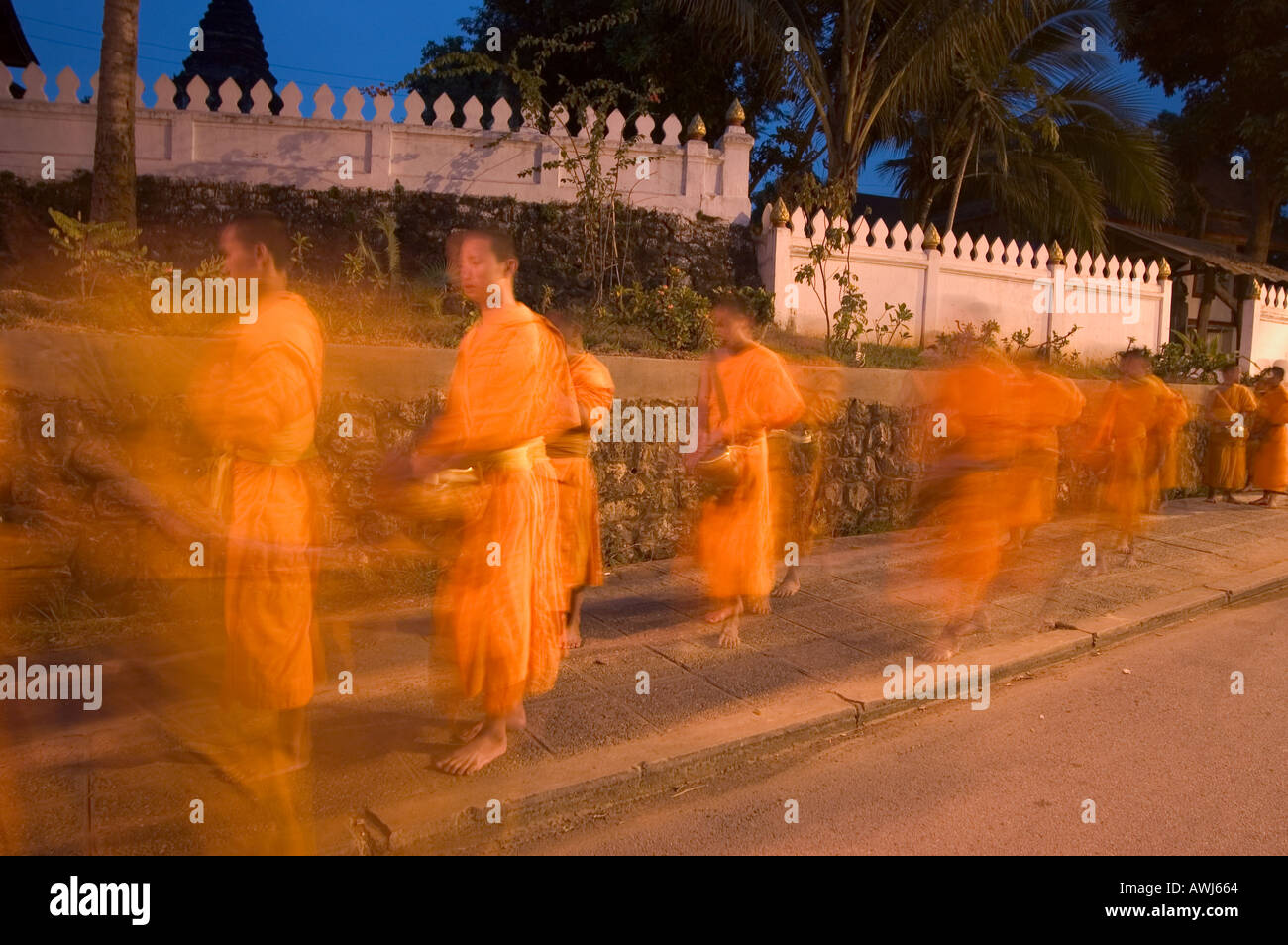 monks collecting morning alms Luang Prabang Laos South East Asia Stock ...