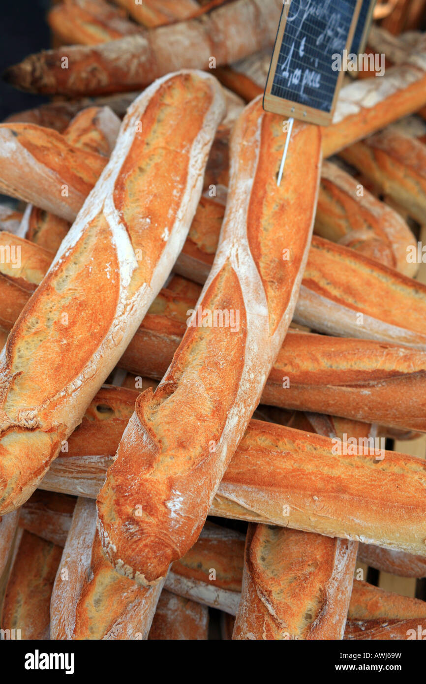 French bread on a market stall in Place Duguesclin, Dinan, Cotes d ...