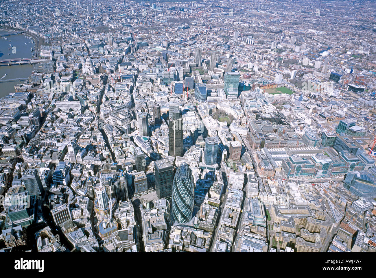 High level oblique aerial view west with River Thames and buildings of ...