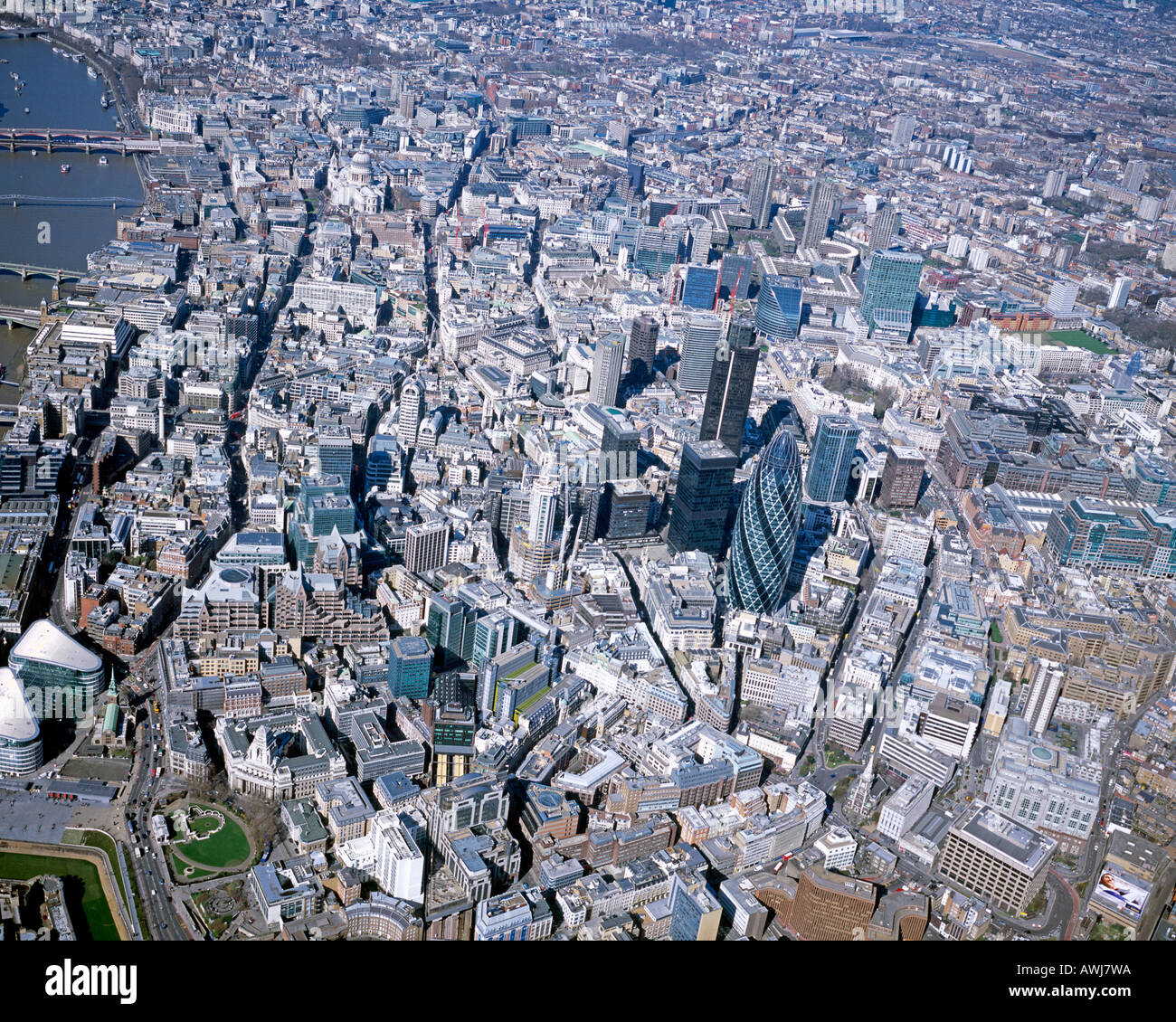 High level oblique aerial view west with River Thames and buildings of ...