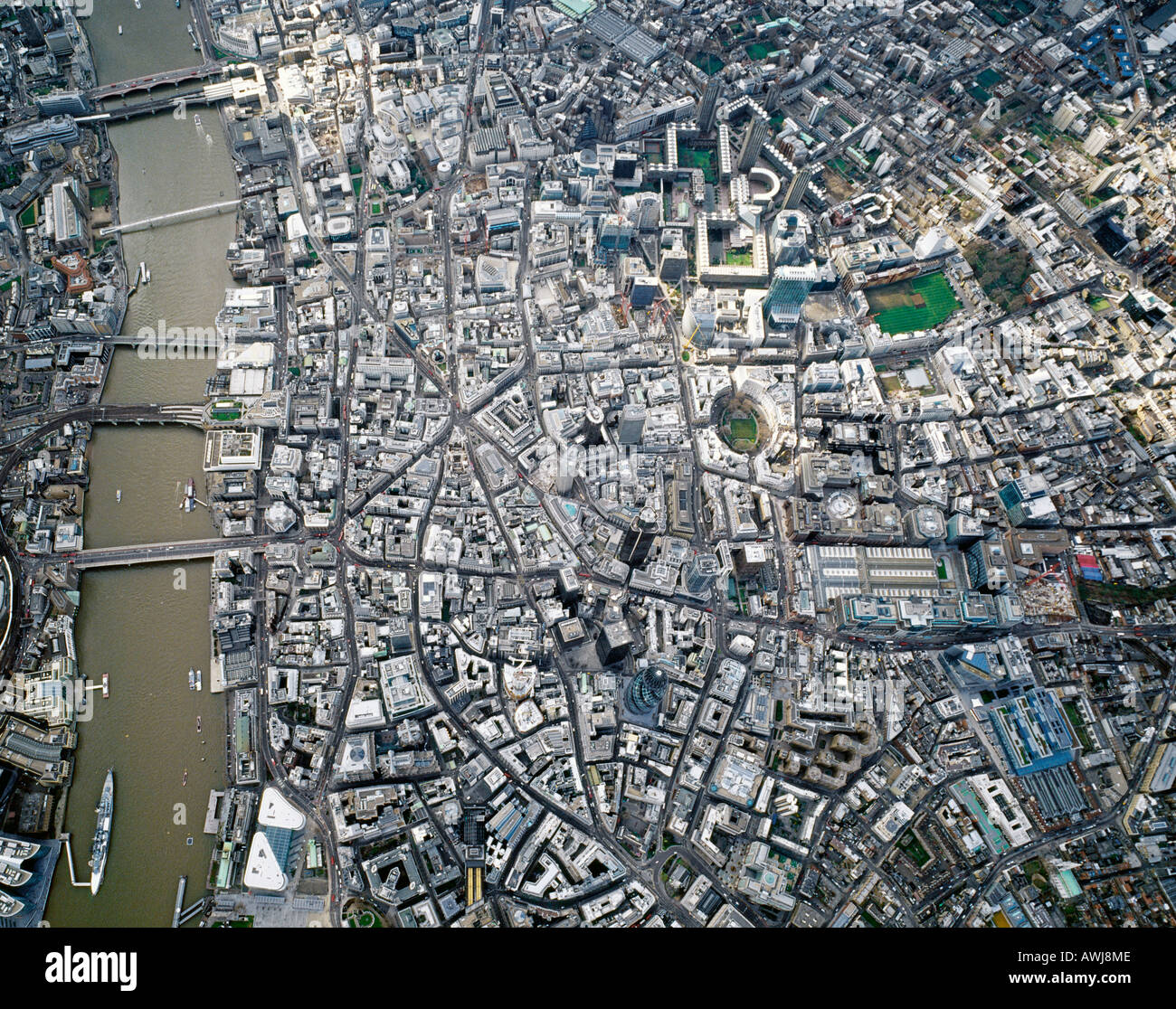 High level oblique aerial view west with River Thames and buildings of ...