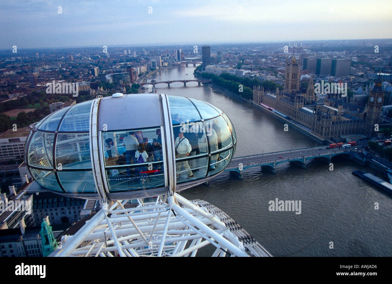 Tourists inside enclosure on giant ferries wheel, Thames River, London ...