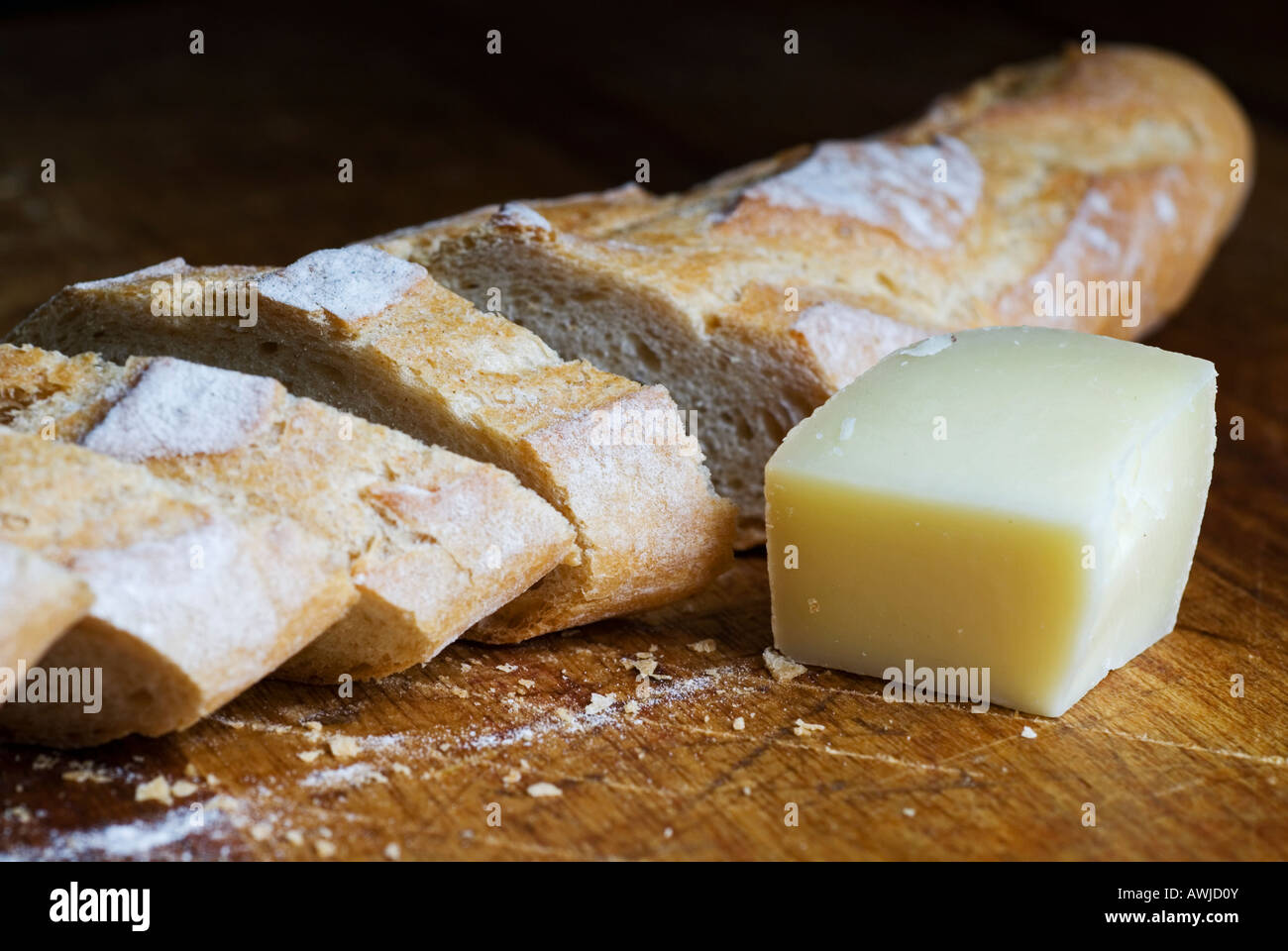 Stock photo of sliced French stick with a lump of Cantal cheese Stock ...