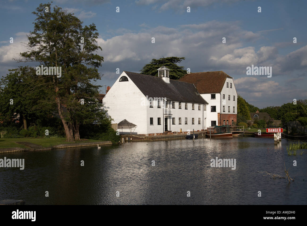 Hambleden Mill on weir with Canada goose and small barges near Henley ...
