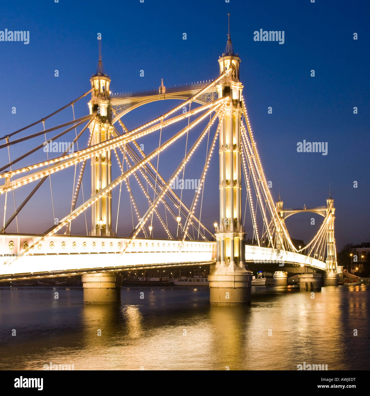 Albert Bridge illuminated at night crossing River Thames in Chelsea ...