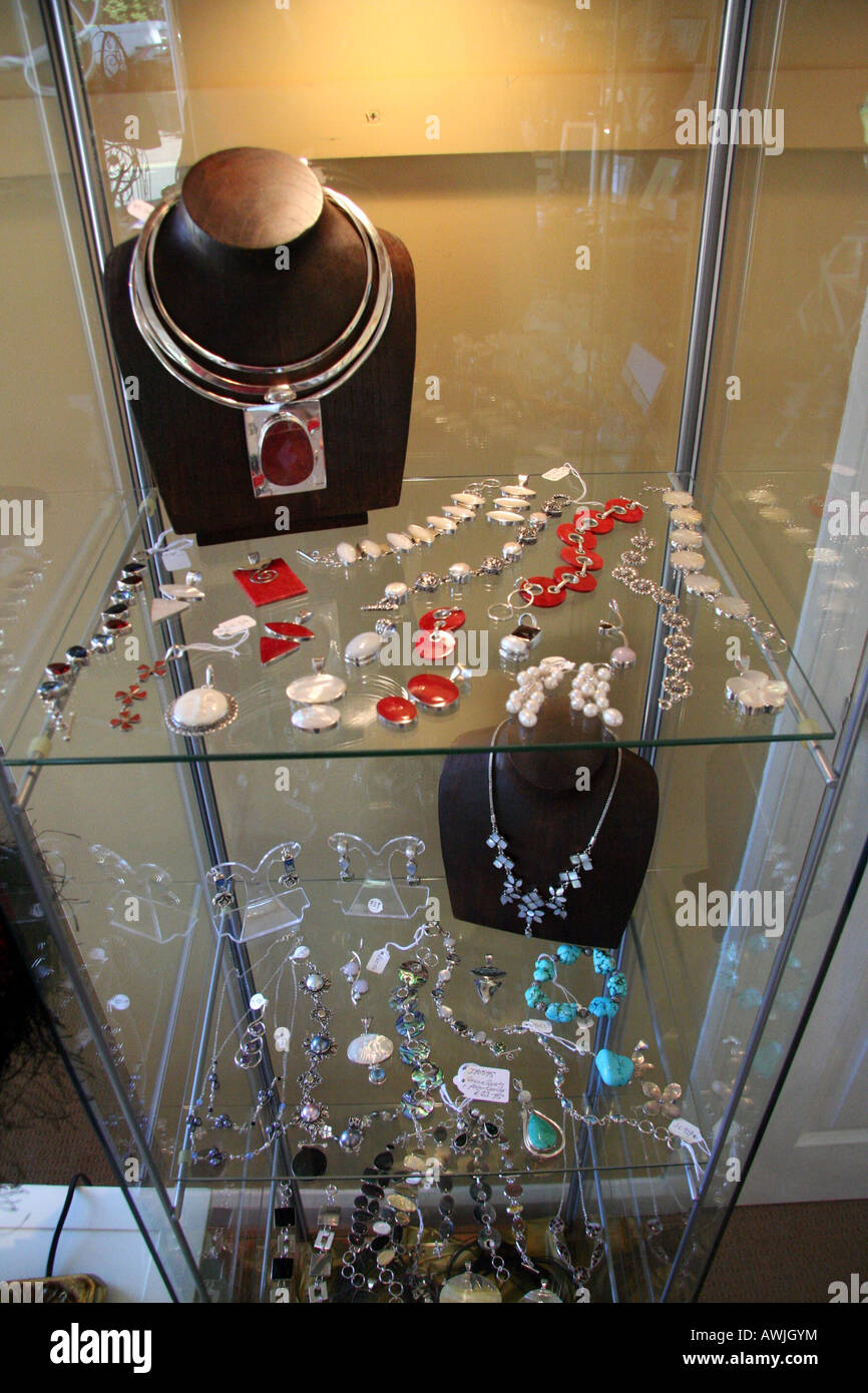 Jewellery in a shop display case Stock Photo - Alamy