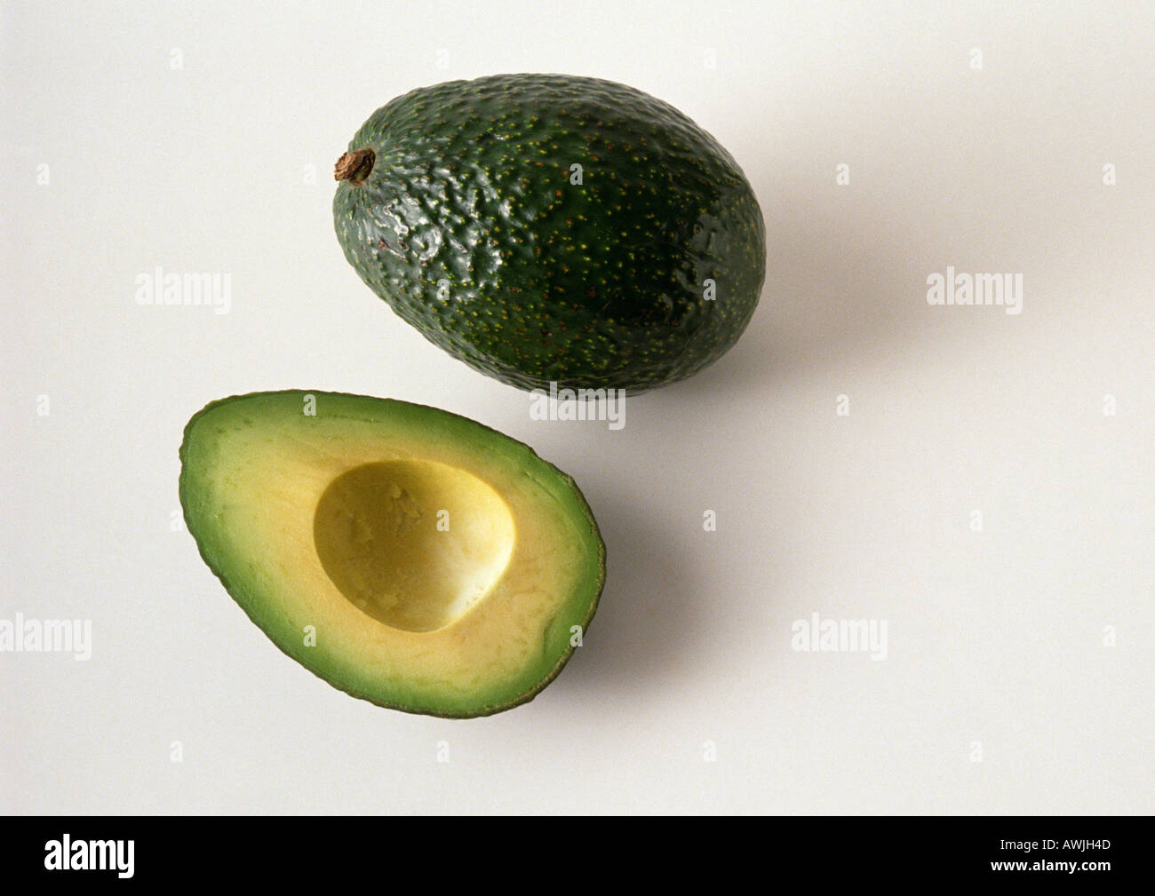 Avocado and avocado half Stock Photo - Alamy