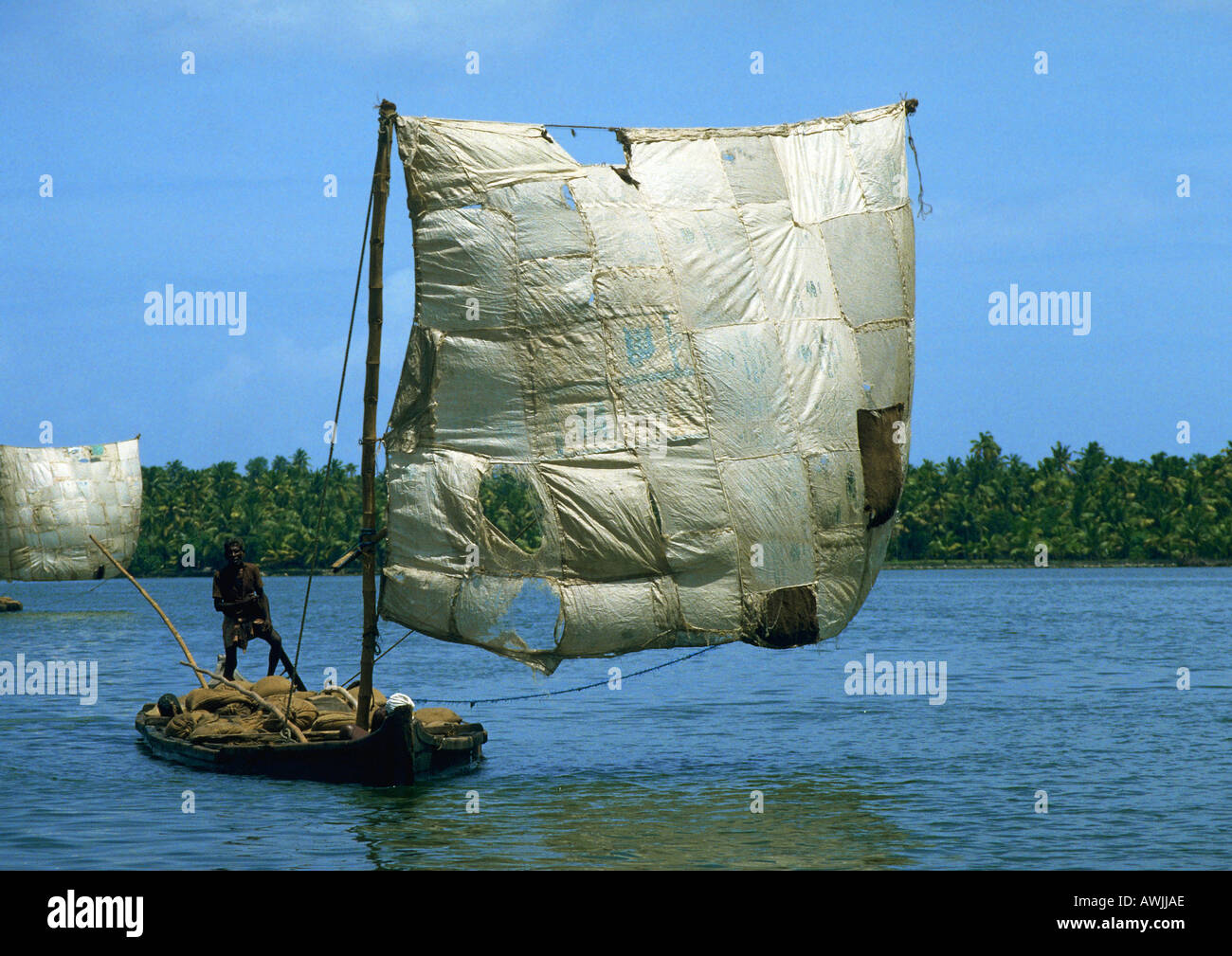 India, person on raft with patchwork sail Stock Photo - Alamy