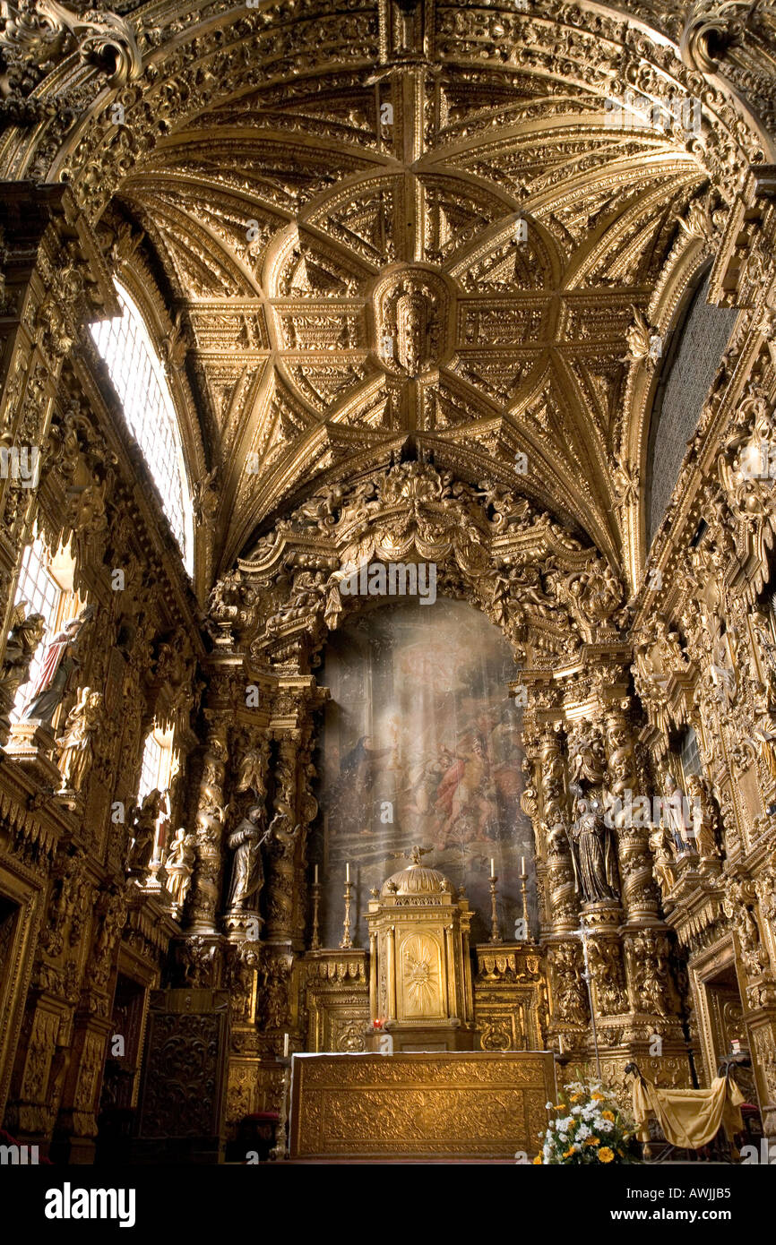 A heavily carved and gilded altar inside the Igreja de Santa Clara in ...
