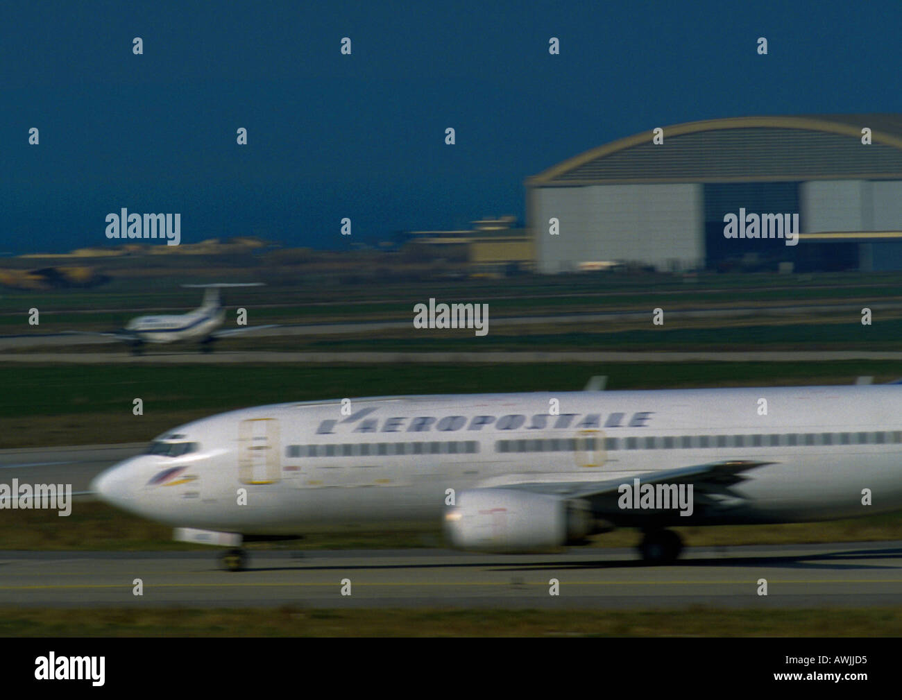 Plane moving on runway Stock Photo - Alamy