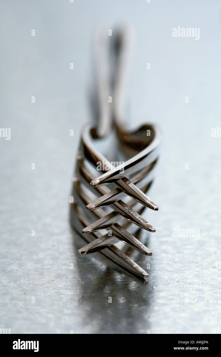Intertwined forks hi-res stock photography and images - Alamy