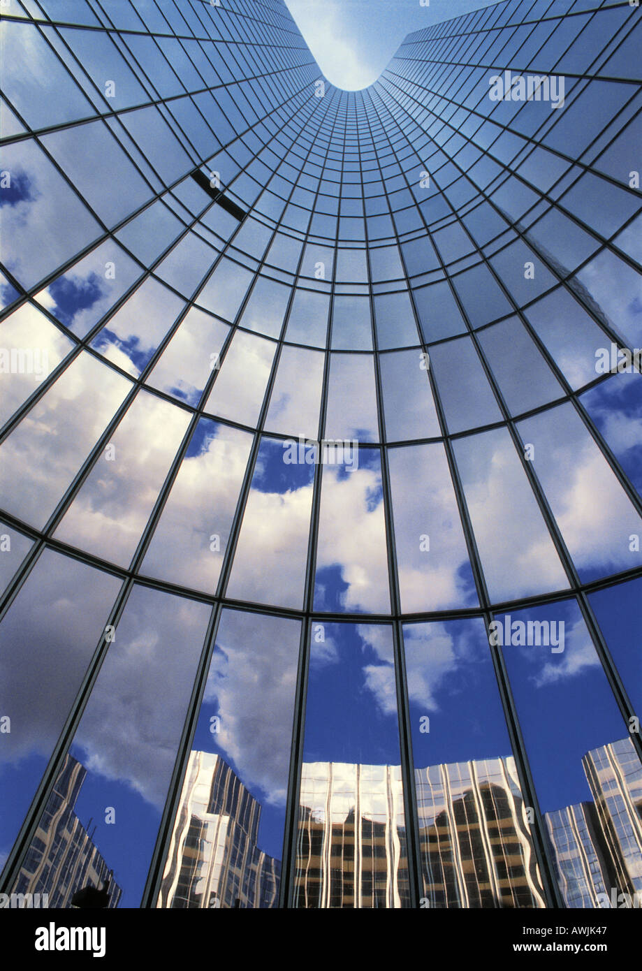 France, Paris, glass facade of skyscraper, reflecting sky and buildings ...