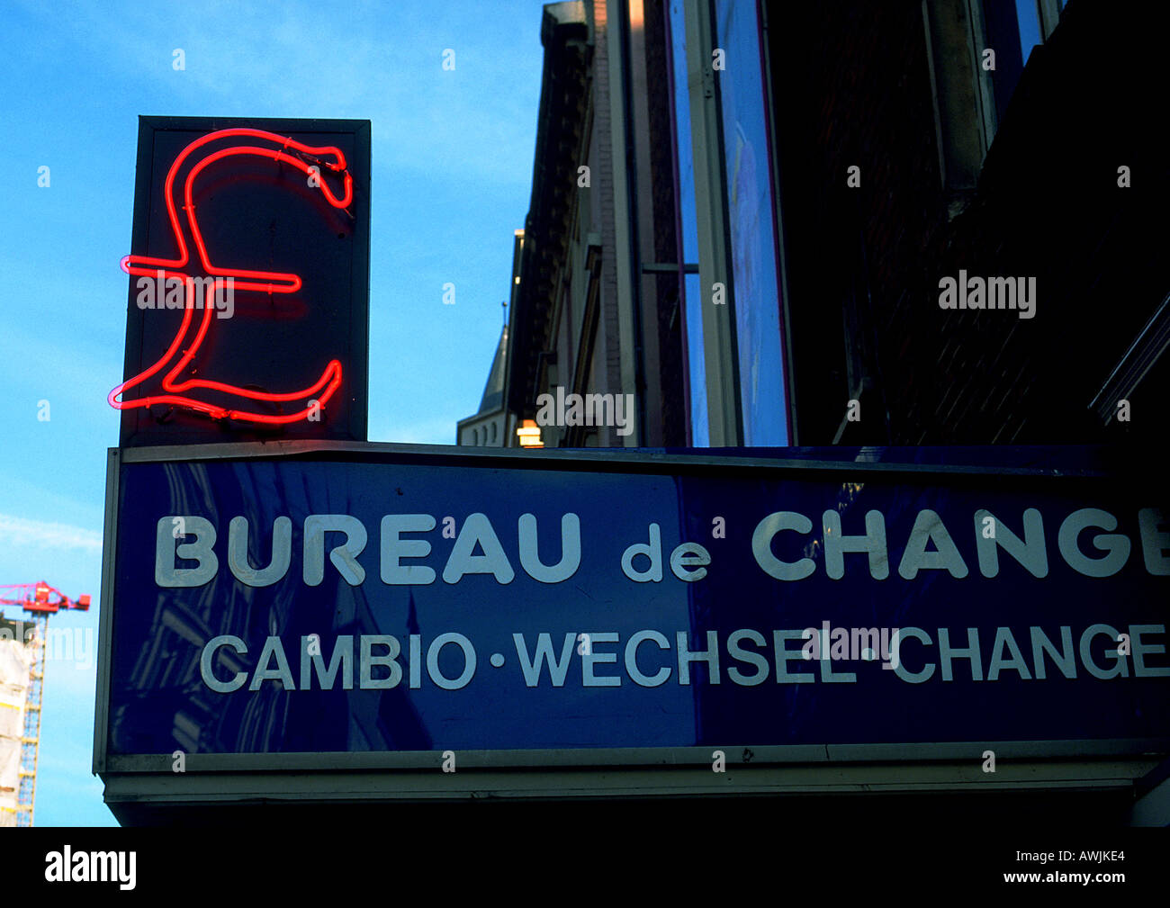 Foreign Exchange Office sign in French with neon pound sign Stock Photo ...