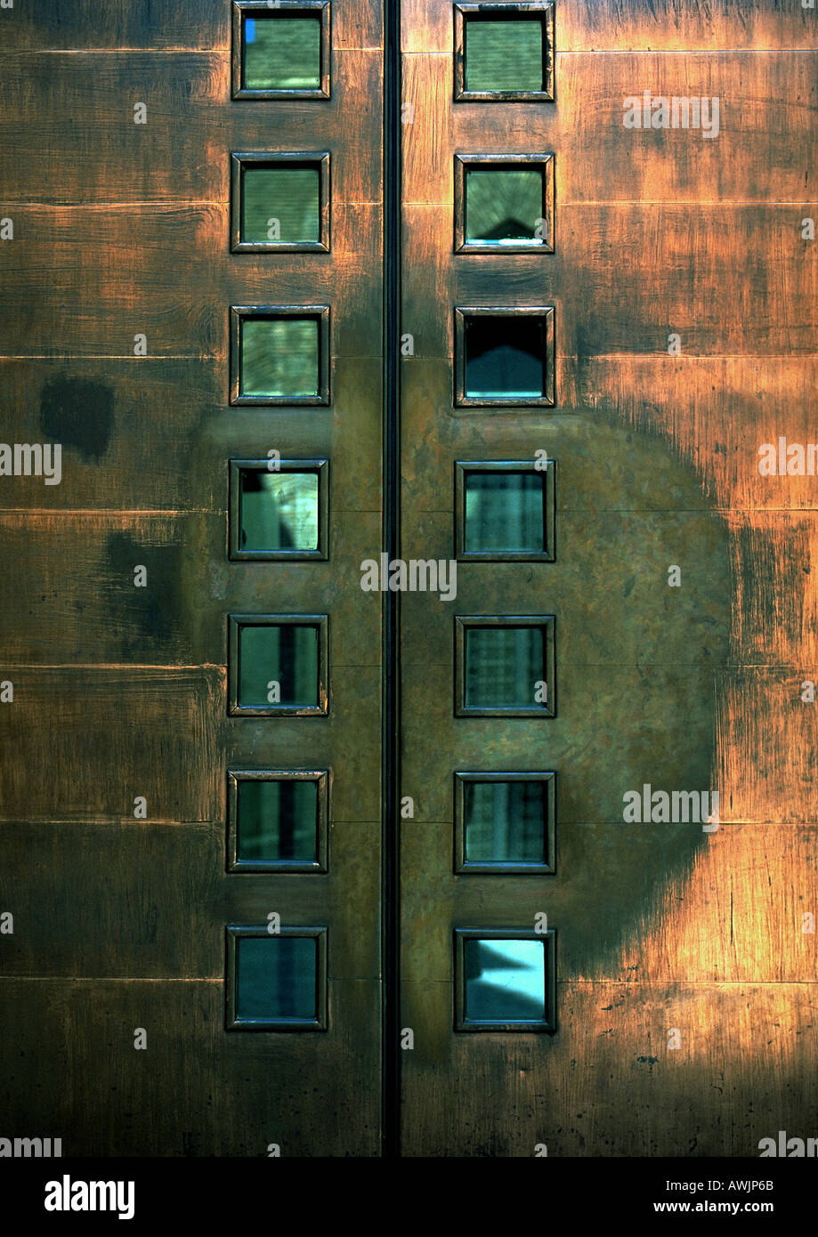 Copper door with small square windows, full frame Stock Photo - Alamy