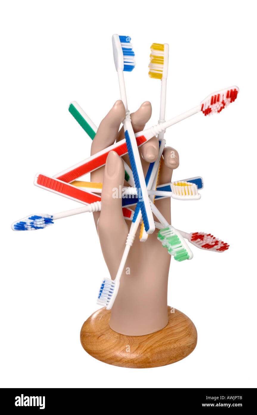 Hand holding toothbrush Cut Out Stock Images & Pictures - Alamy
