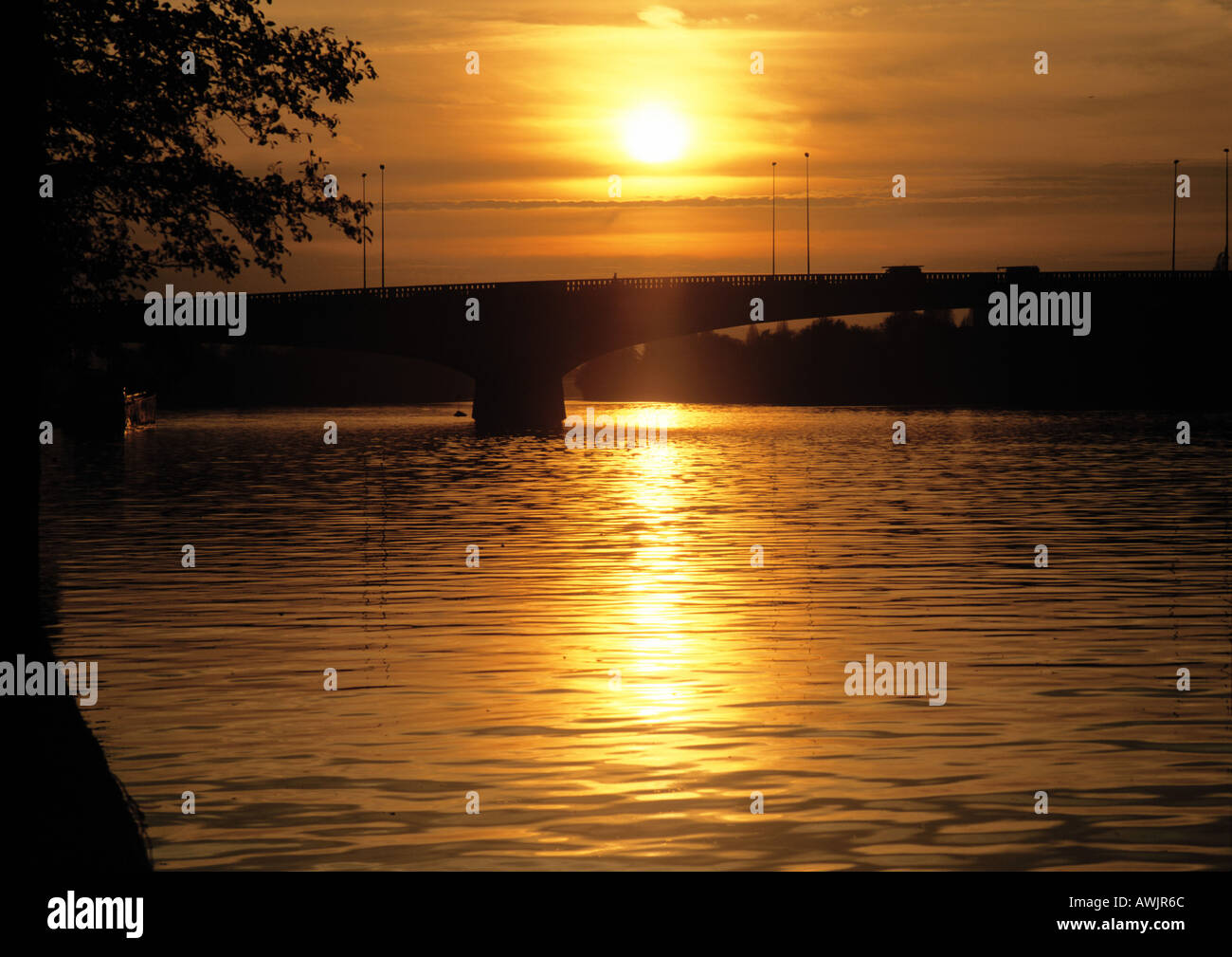 Sunset over water Stock Photo - Alamy