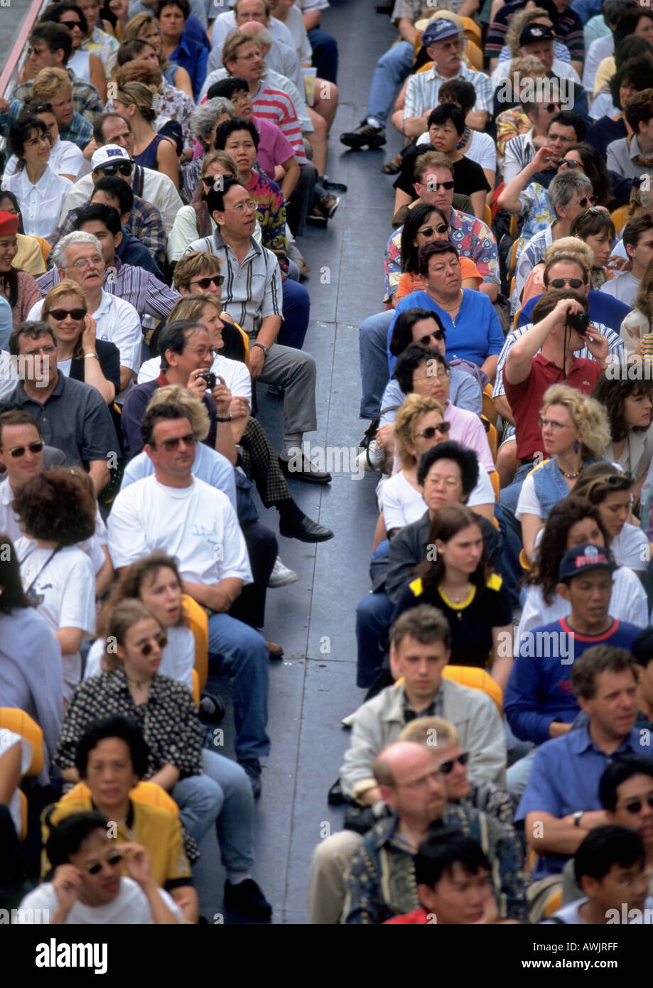 Crowd sitting in bleachers, blurred Stock Photo - Alamy